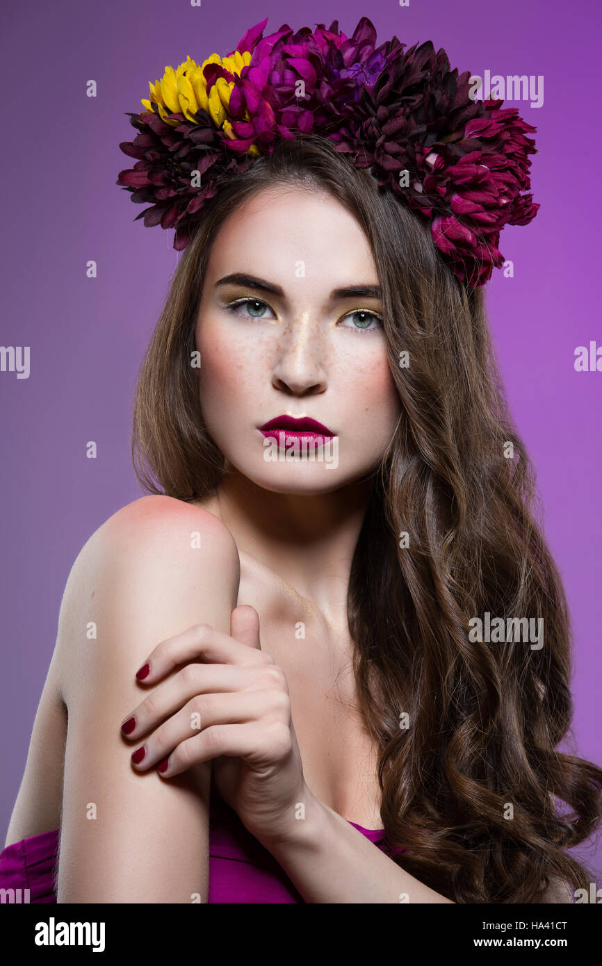 Beautiful girl with flowers on head Stock Photo - Alamy