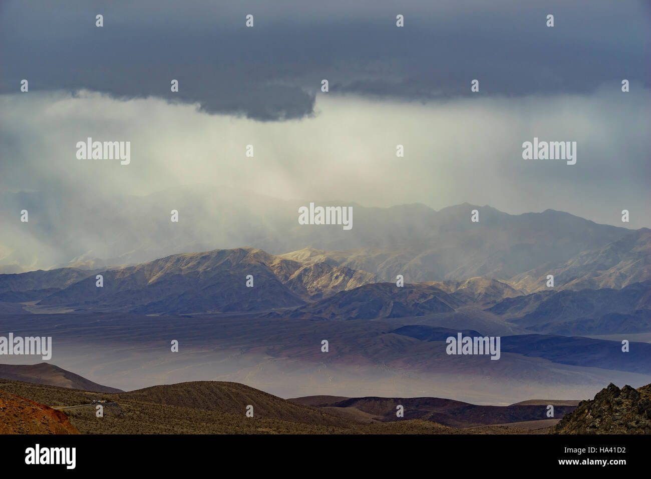 Beautiful sun ray while raining over mountain at Death Valley National ...