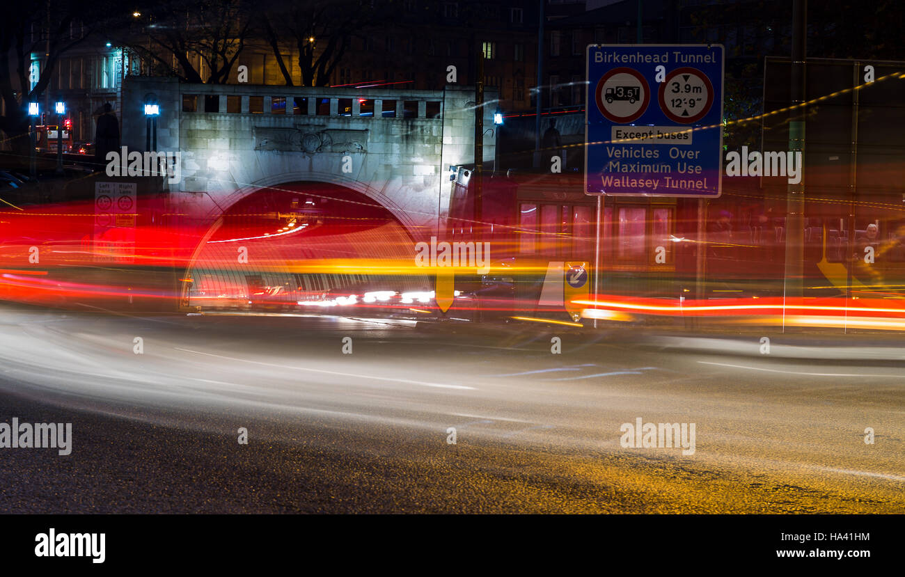 Cars & buses circle the roundabout as they enter or leave the ...