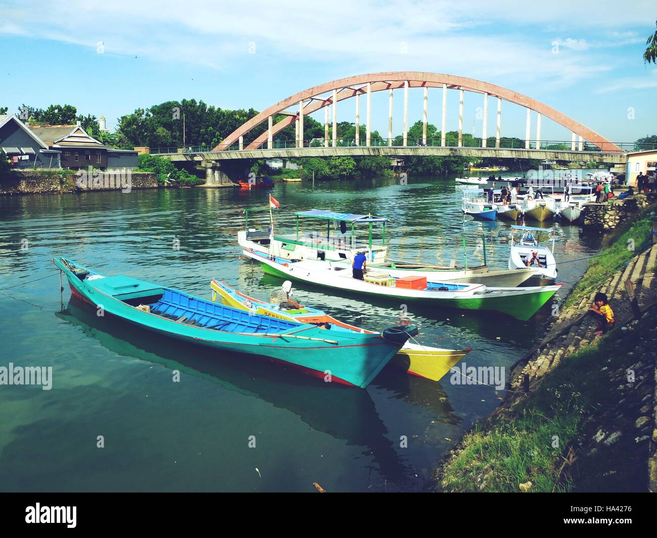 Boats under the bridge Stock Photo - Alamy