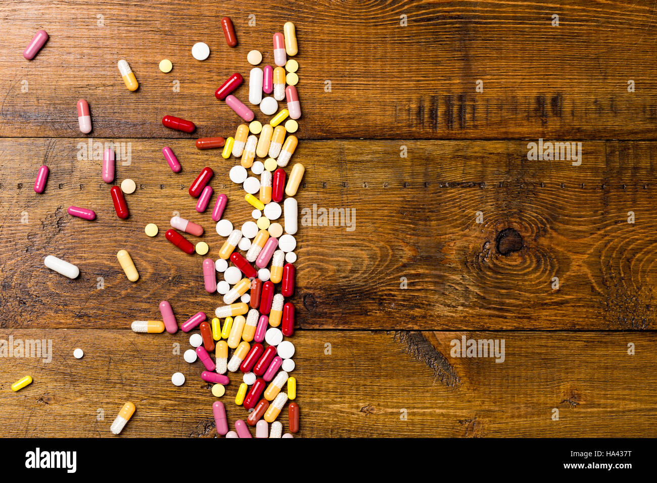 Border from various colorful capsules and pills Stock Photo - Alamy