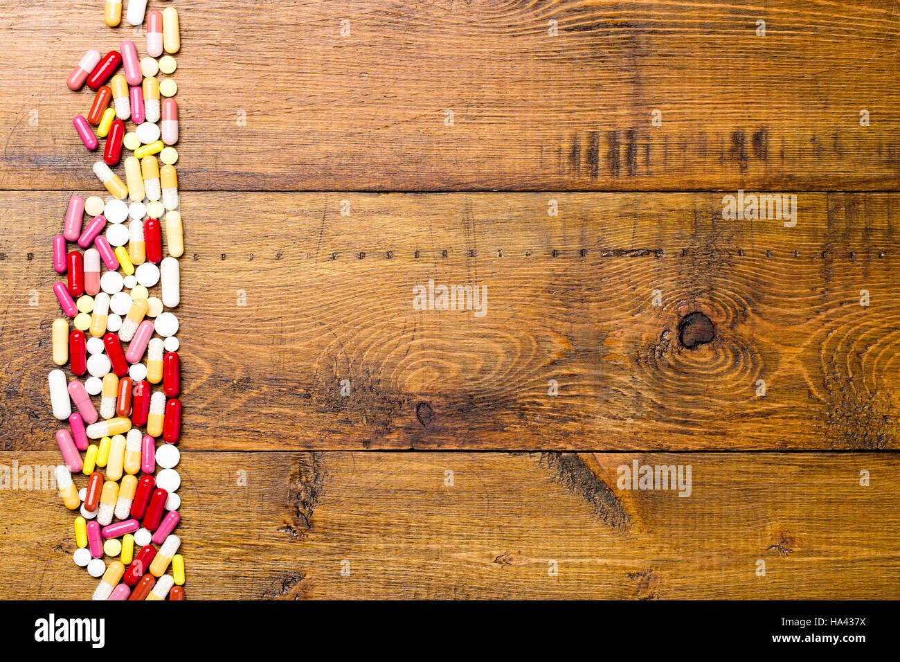 Border from various colorful capsules and pills Stock Photo - Alamy