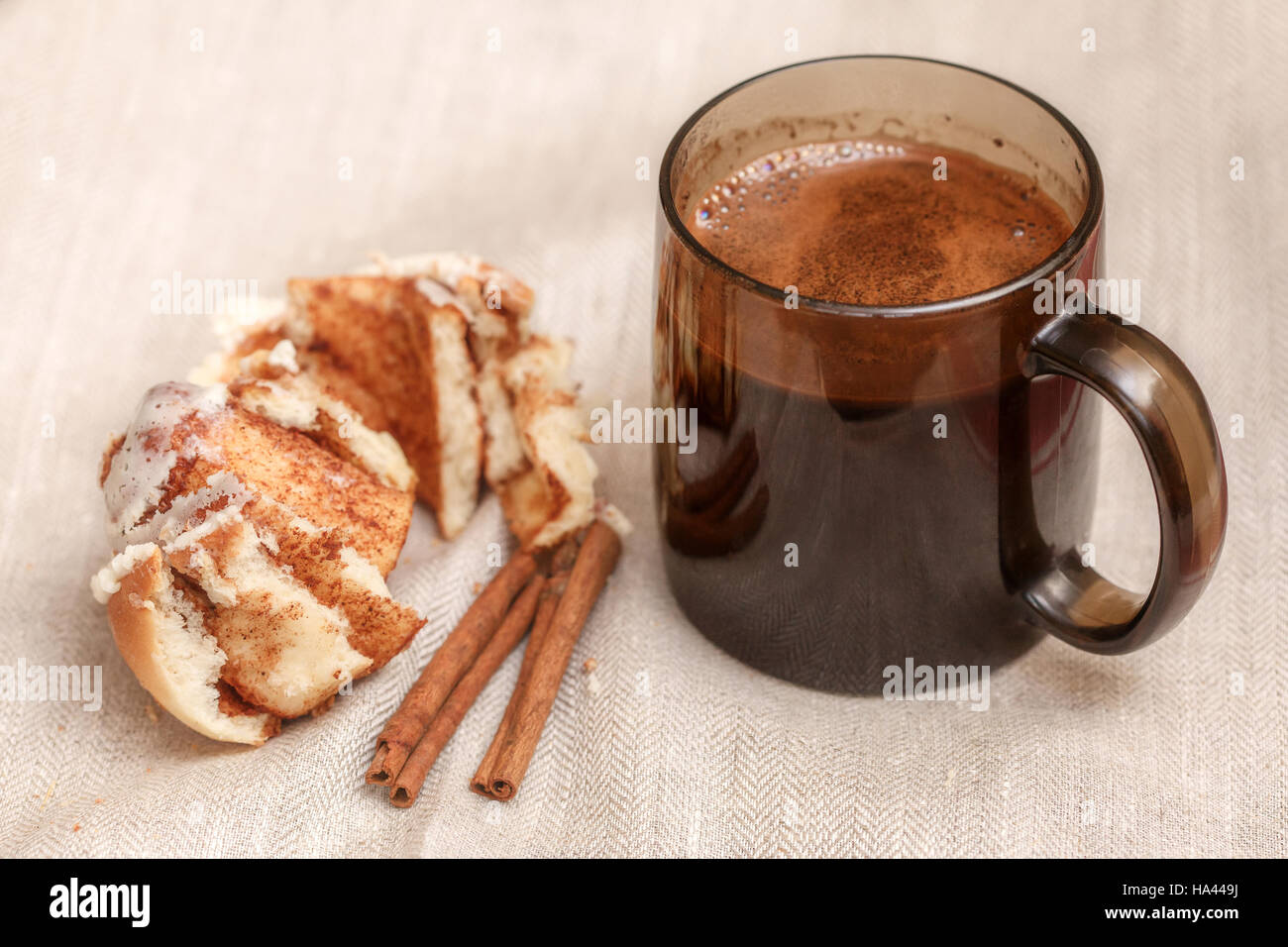 Freshly cinnabon French bun with cinnamon and coffee, selective focus ...