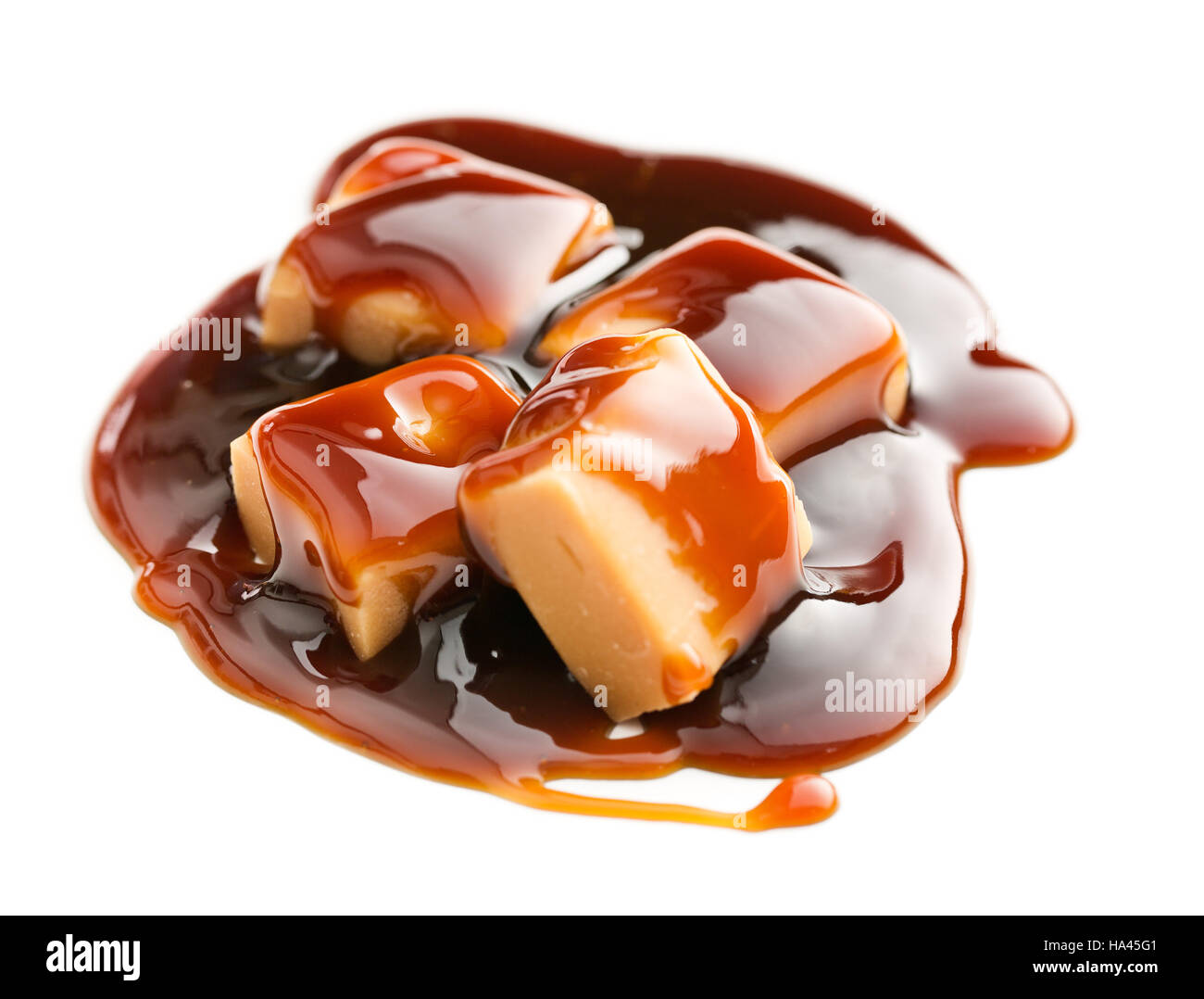 Caramel candies with caramel sauce isolated on white background Stock ...
