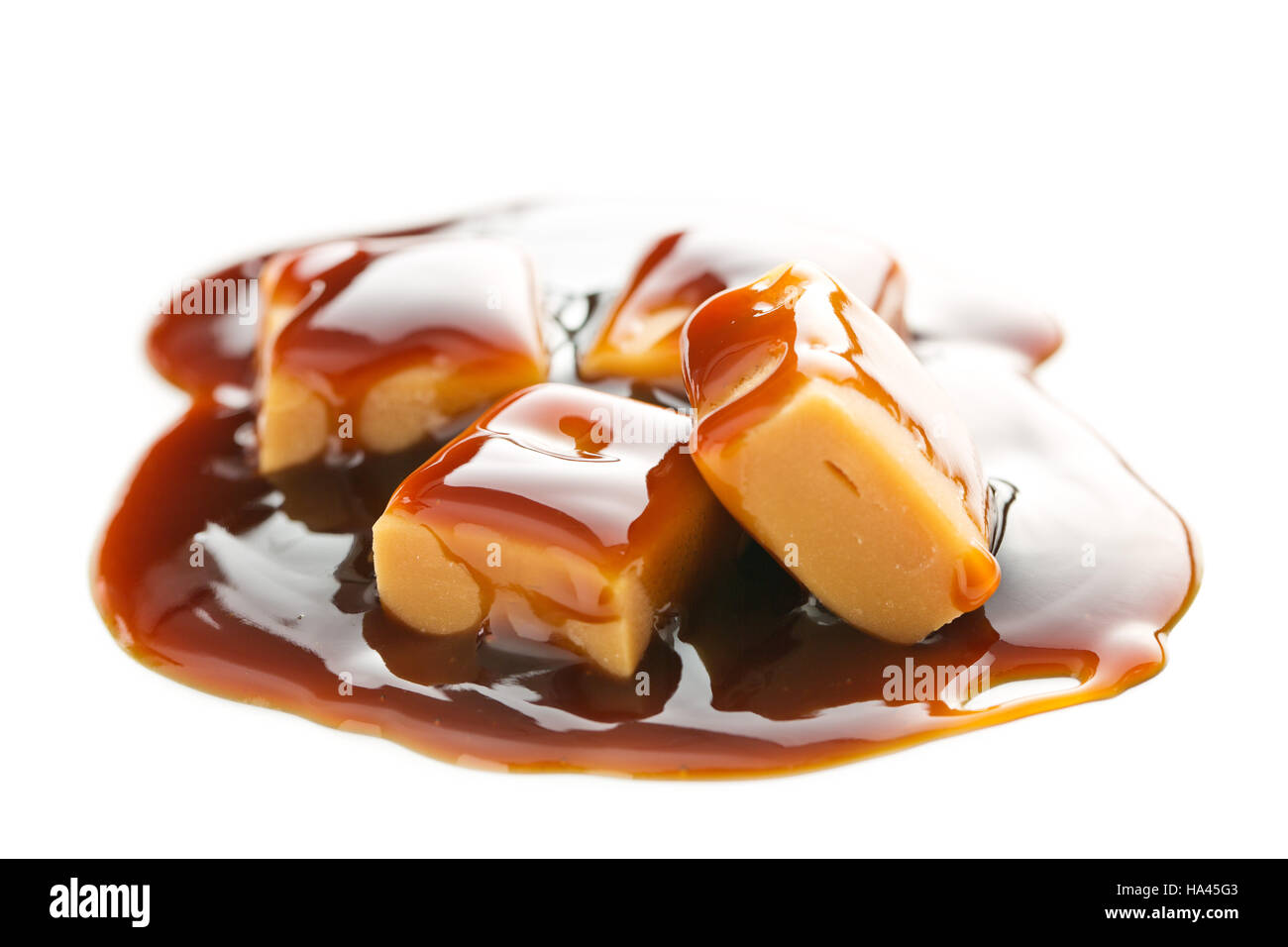 Caramel candies with caramel sauce isolated on white background Stock ...
