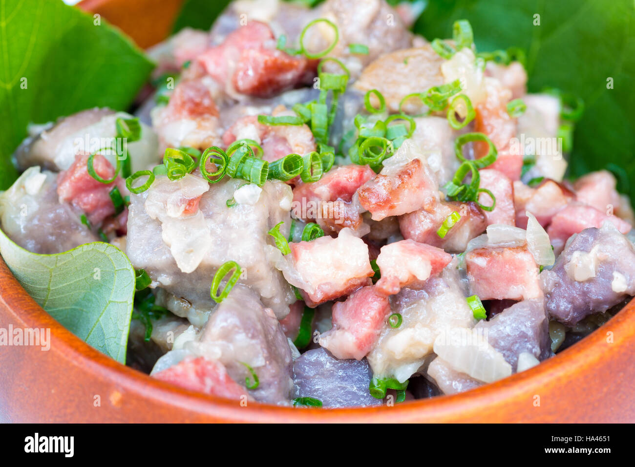 A simple Hawaiian hash made with local taro, thick bacon, green onions ...