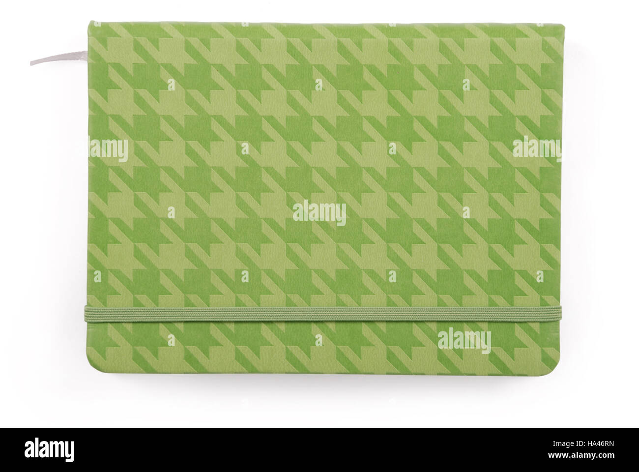 Green closed notepad isolated on white background with soft shadow ...