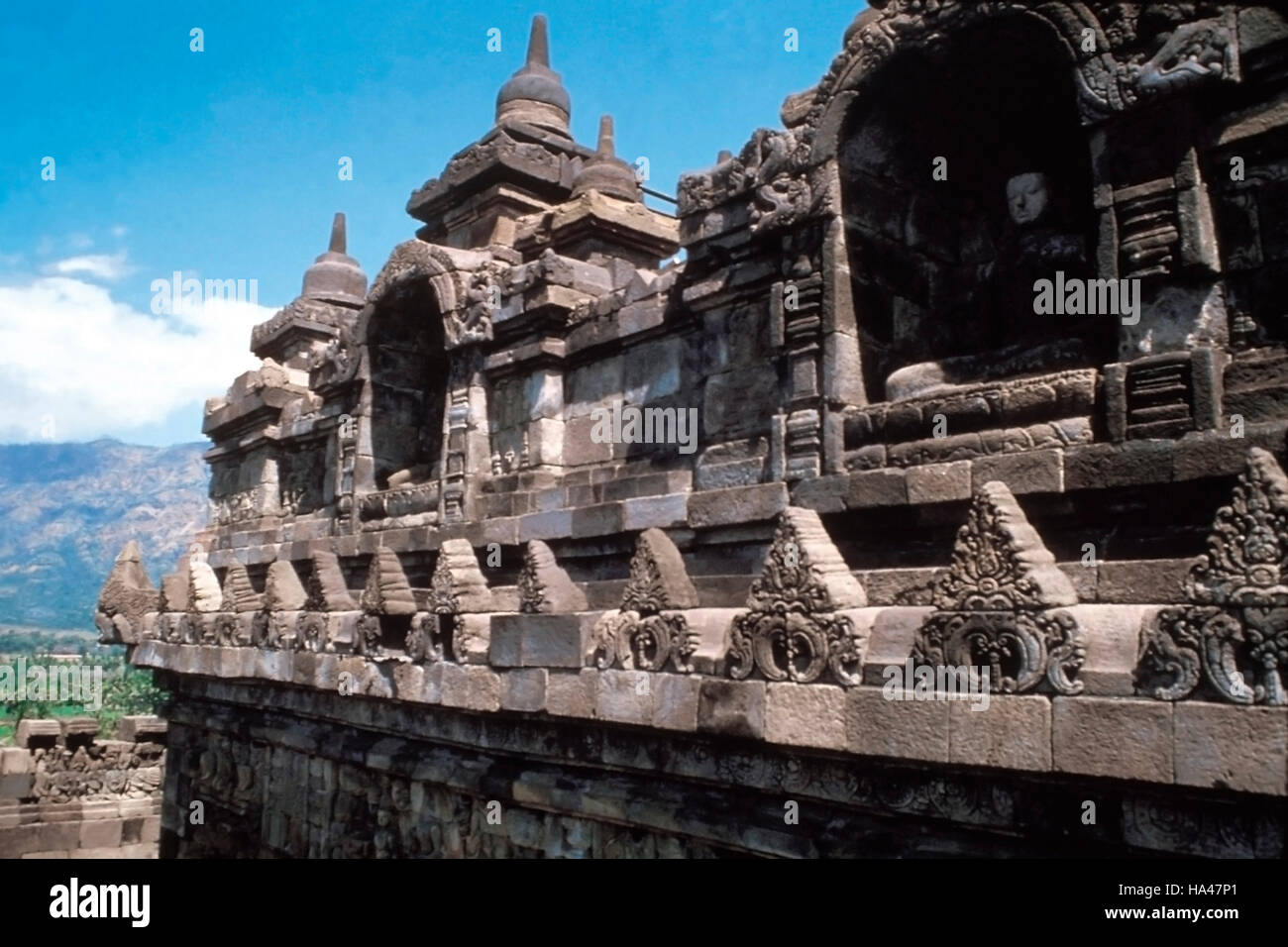 Buddha in niche. Borobudur is believed to be a classical stupa ...