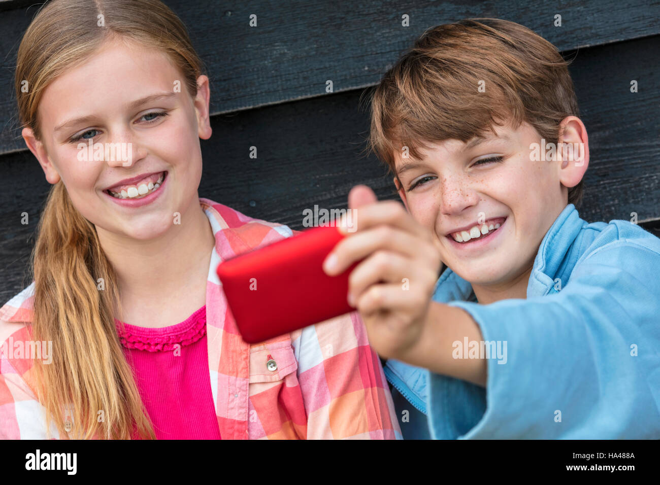 Boy and girl talking outside hi-res stock photography and images - Alamy