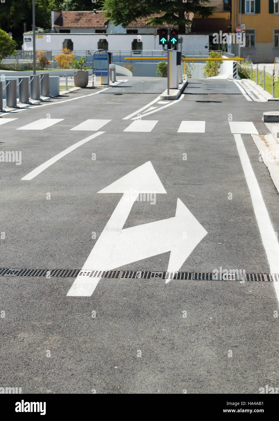 Directional white arrows symbol, in a typical entryway parking ...
