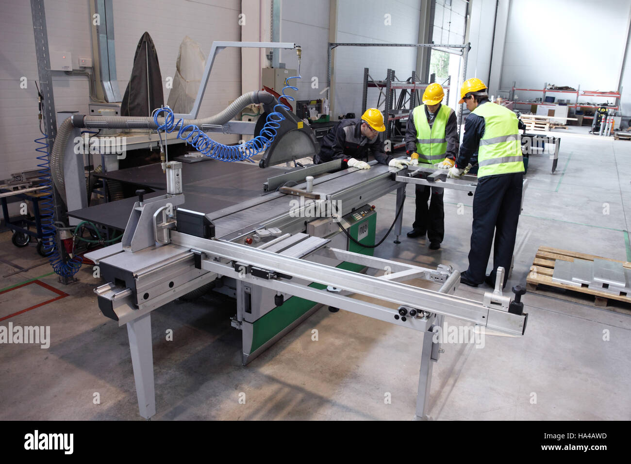 Group of industrial factory workers working with CNC machine Stock ...