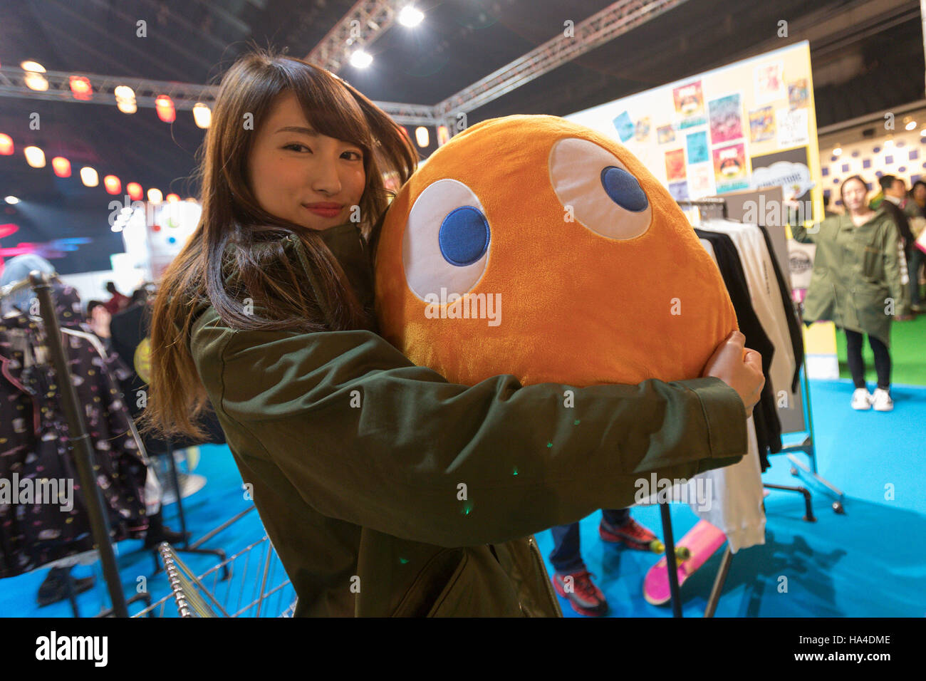 A Pac-Store staff member hugs a video game character (ghost Pokey ...