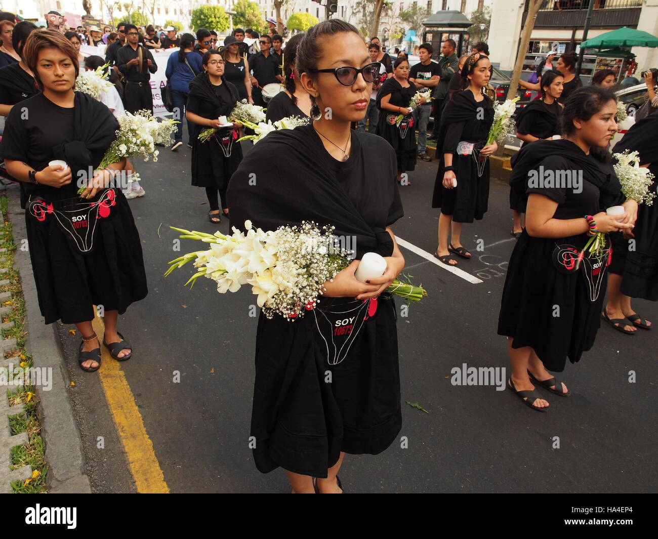 Lima, Peru. 26th Nov, 2016. Women activists march and protest in front ...