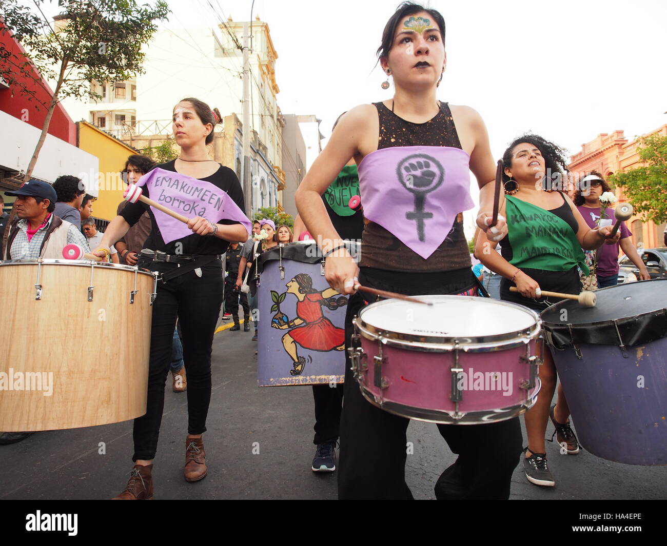 Lima, Peru. 26th Nov, 2016. Women activists march and protest in front ...