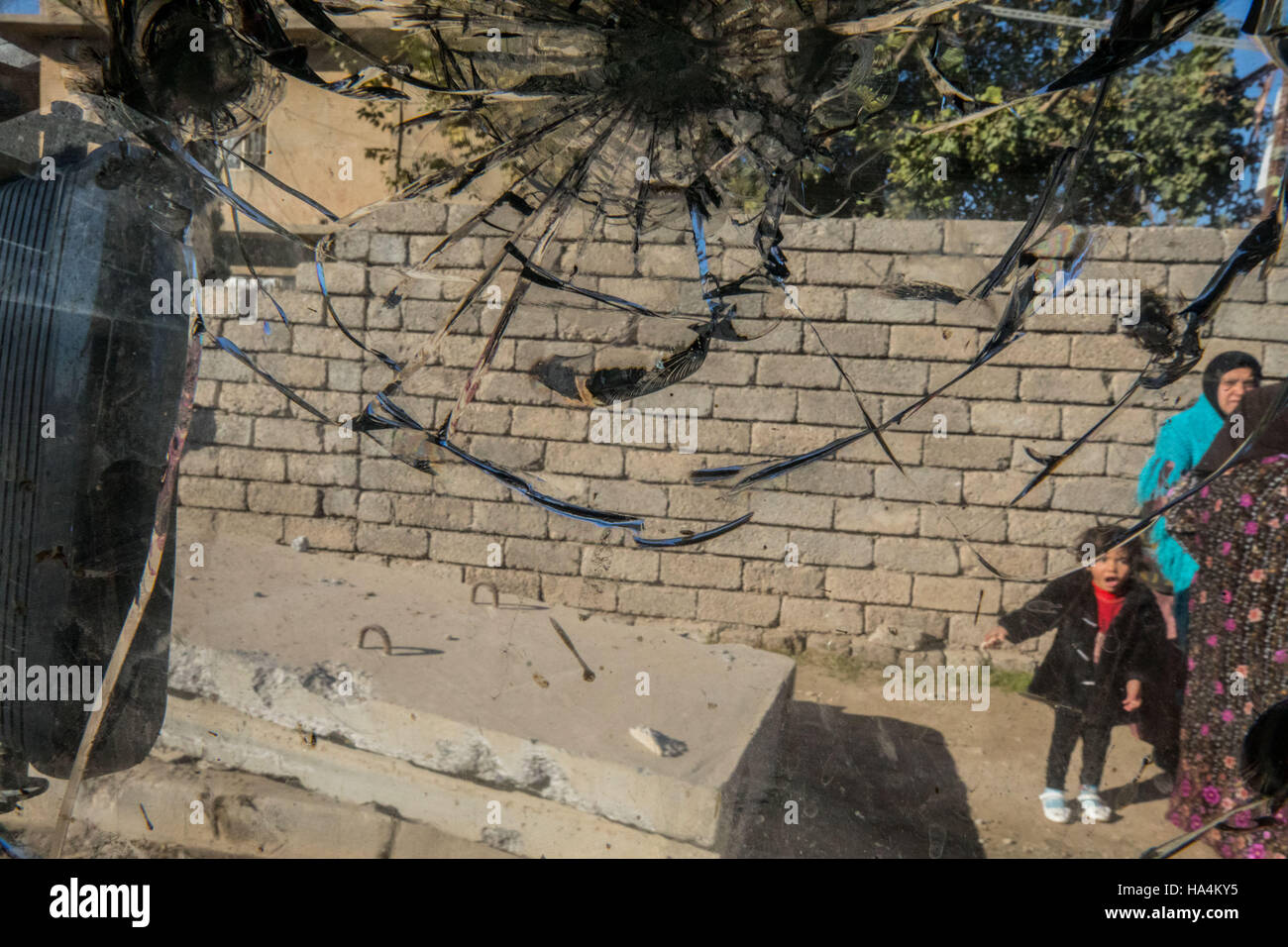 Mosul, Ninewa Province, IRAQ. 25th Nov, 2016. A family looks at a ...