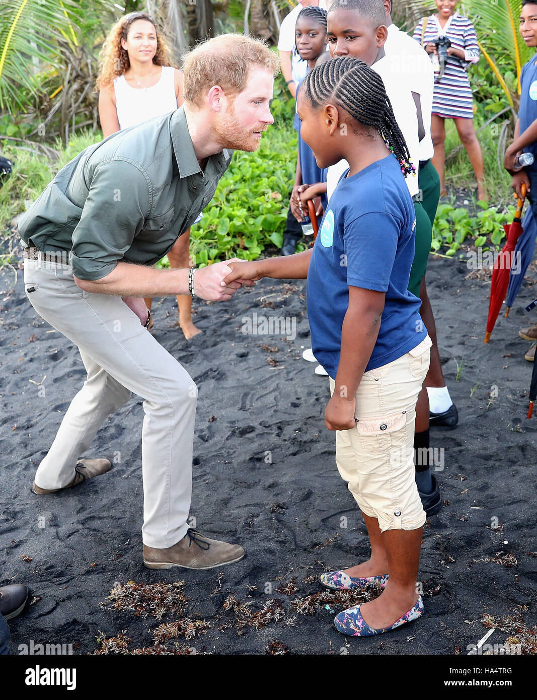 Prince Harry meets children during a visit to a Turtle Conservation ...
