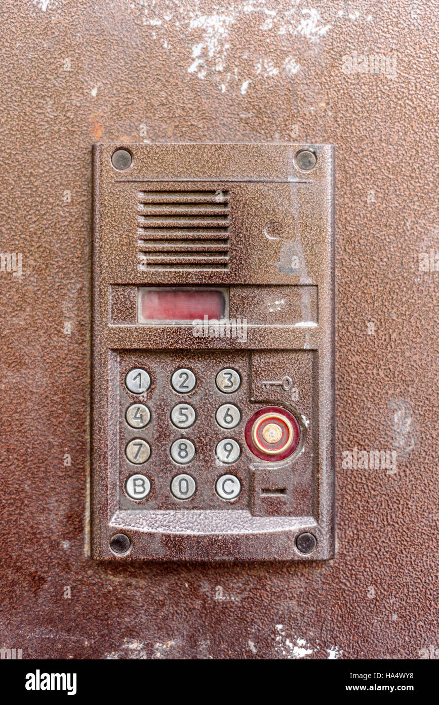 Vertical composition of an electronic door entry keypad in brown metal ...