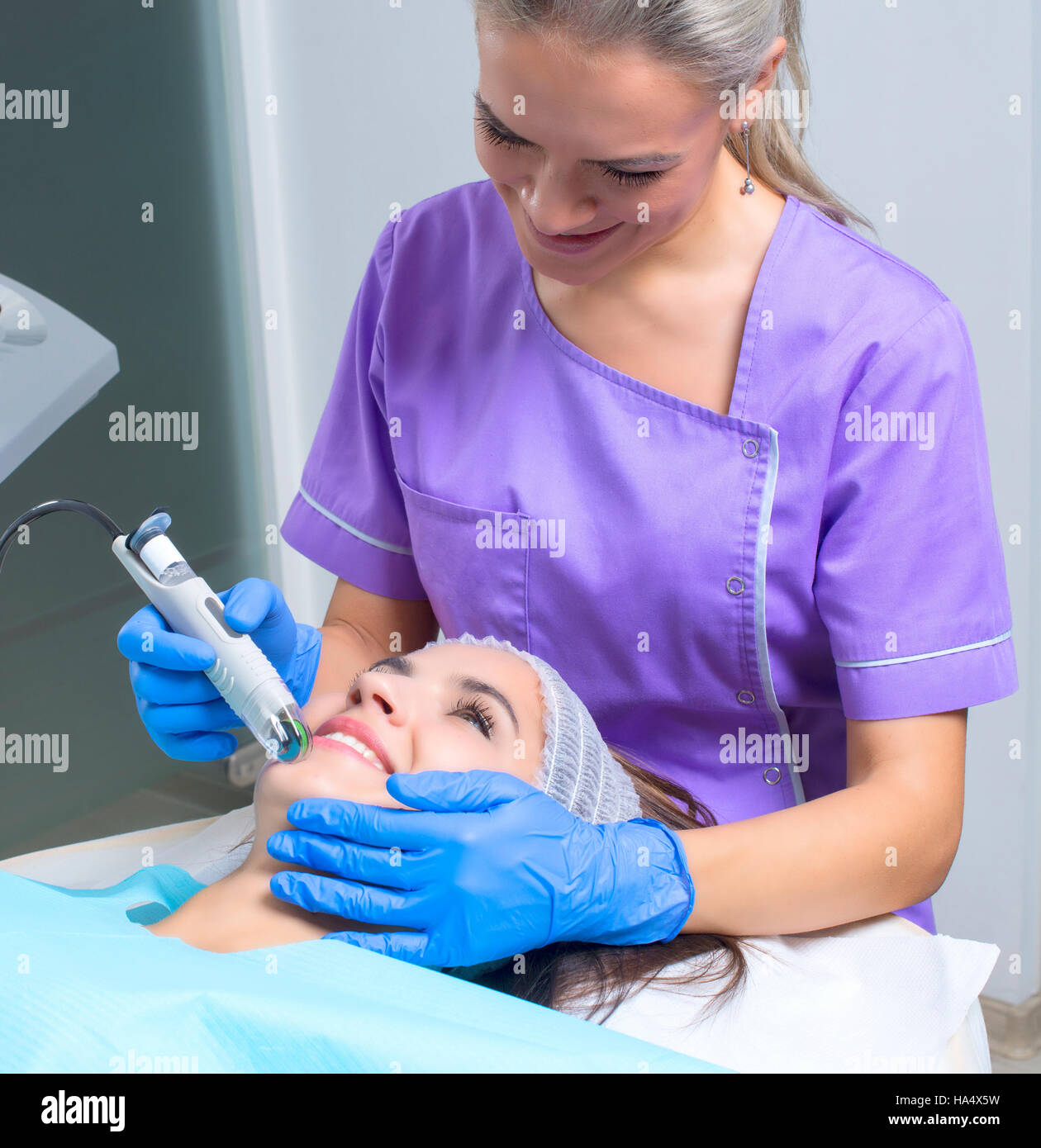 Image of Young beautiful woman gets skin treatment Stock Photo - Alamy
