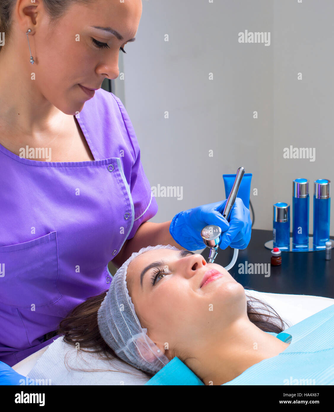 Young beautiful woman gets professional skin treatment Stock Photo - Alamy