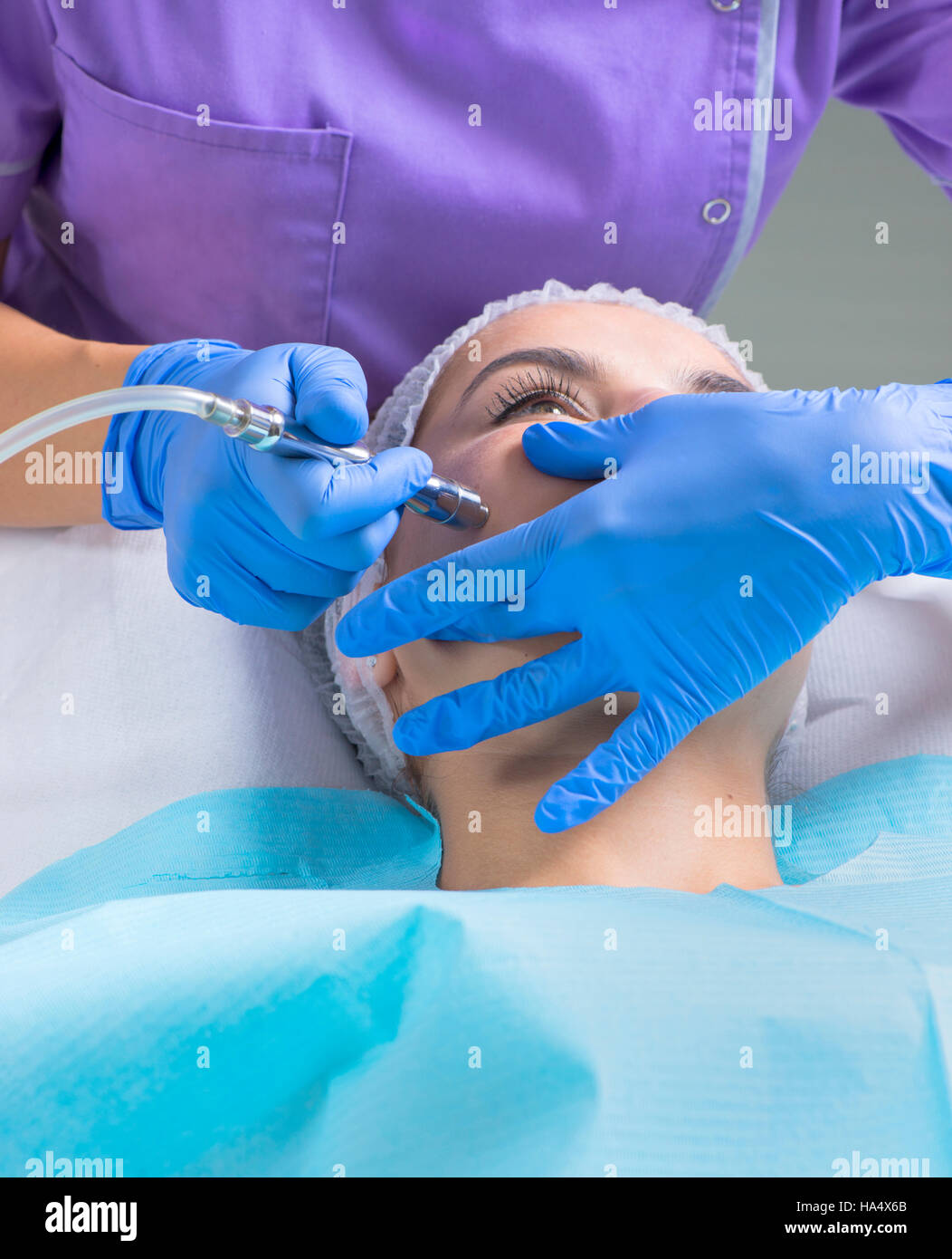 Young beautiful woman gets professional skin treatment Stock Photo - Alamy