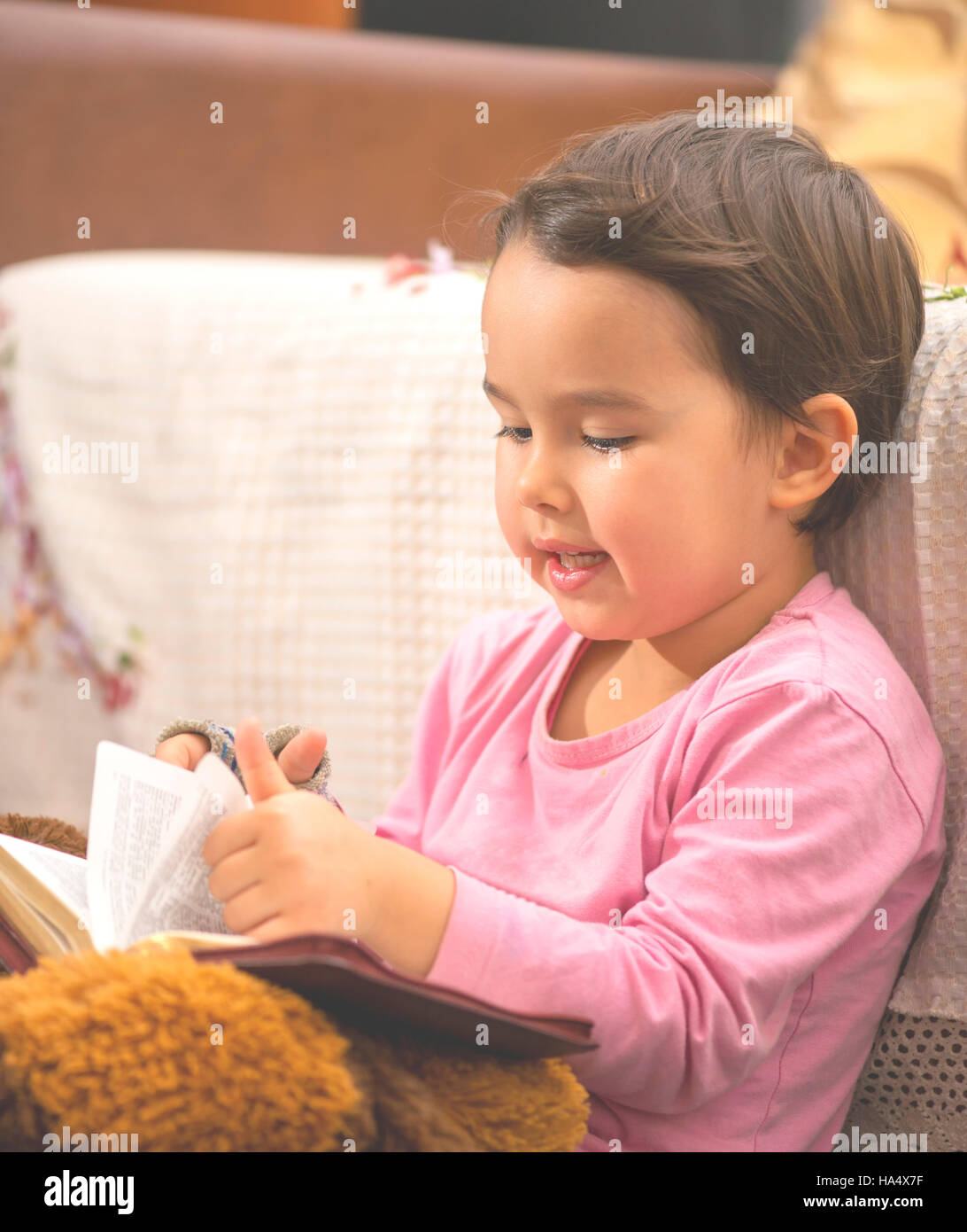 Cute little child girl reading the Bible Stock Photo - Alamy