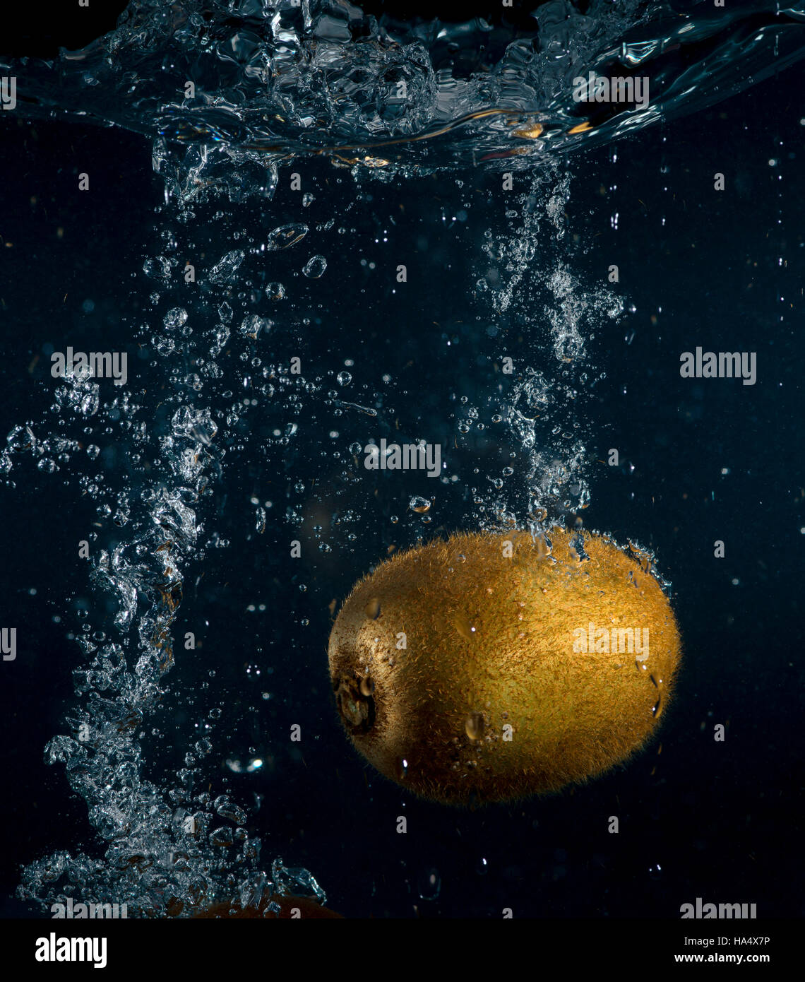 kiwi fruit splashing in the water Stock Photo - Alamy