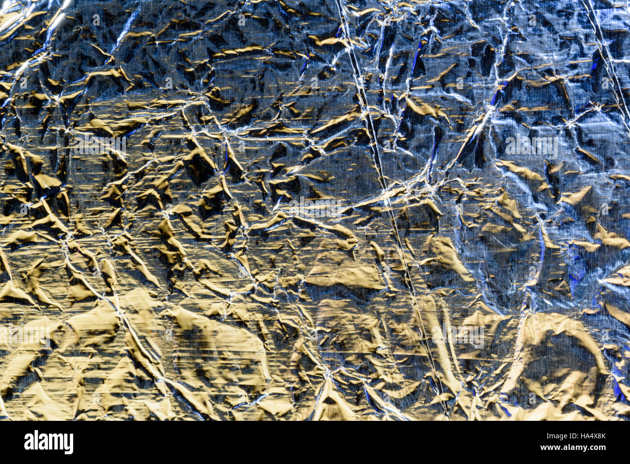 Crumpled Aluminum tin foil texture with light reflections on the shiny ...