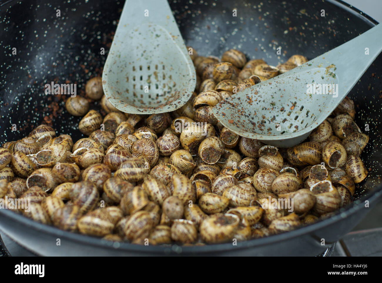 Escargots (snails) prepared in a pan and ready to eat Stock Photo - Alamy