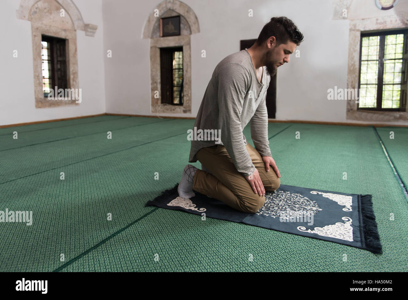 Muslim Man Is Praying In The Mosque Stock Photo - Alamy