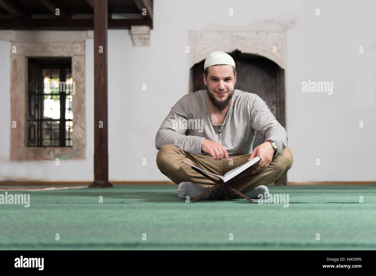 Adult Muslim Man Is Reading The Koran In The Mosque Stock Photo - Alamy