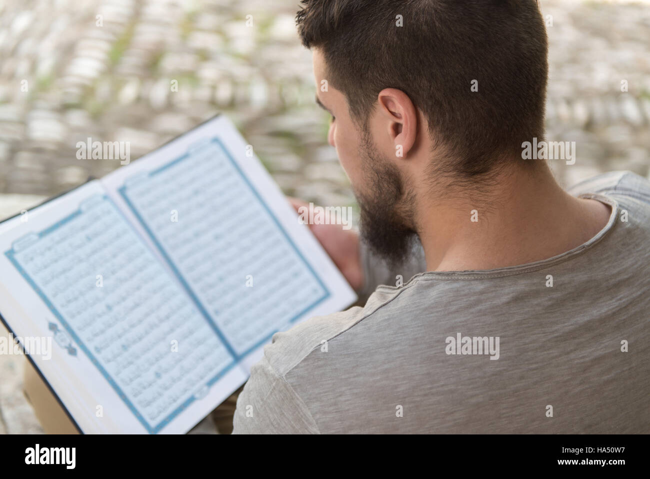 Humble Muslim Man Is Reading The Koran In The Mosque Outdoors Stock ...