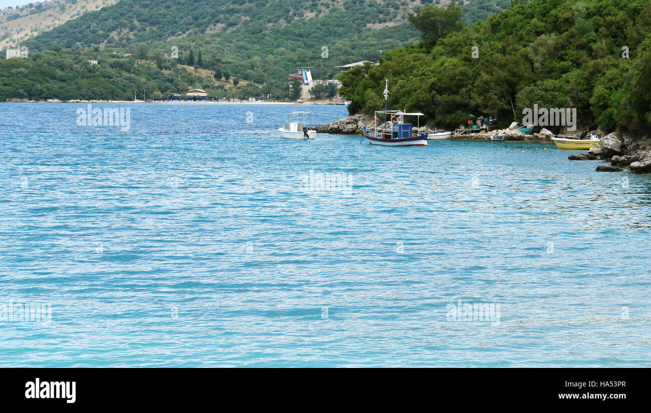 View from the beach with fishing-boat on the Ionian Sea Stock Photo - Alamy