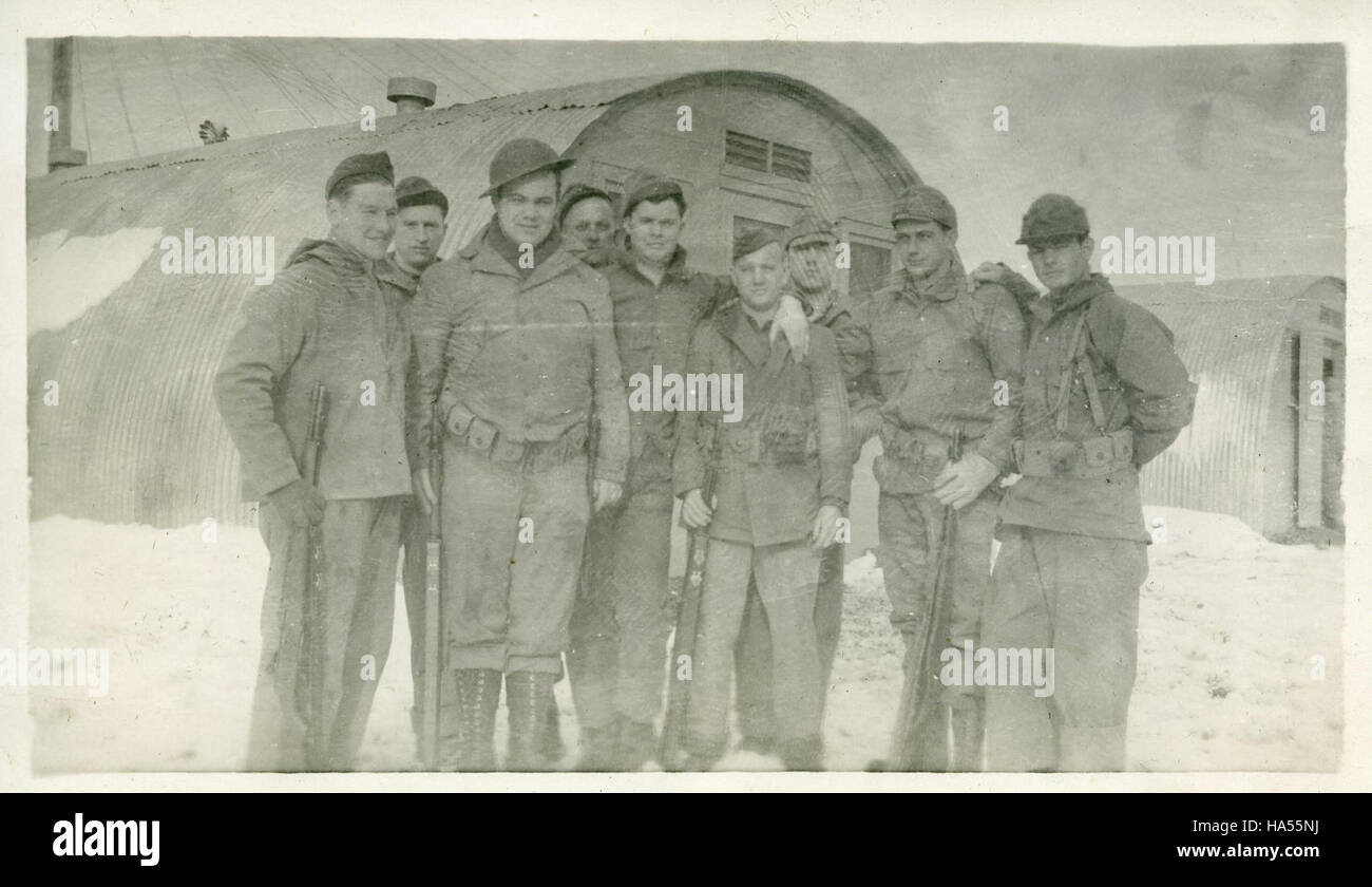 The image of nine individuals near a Quonset hut in Alaska's national ...