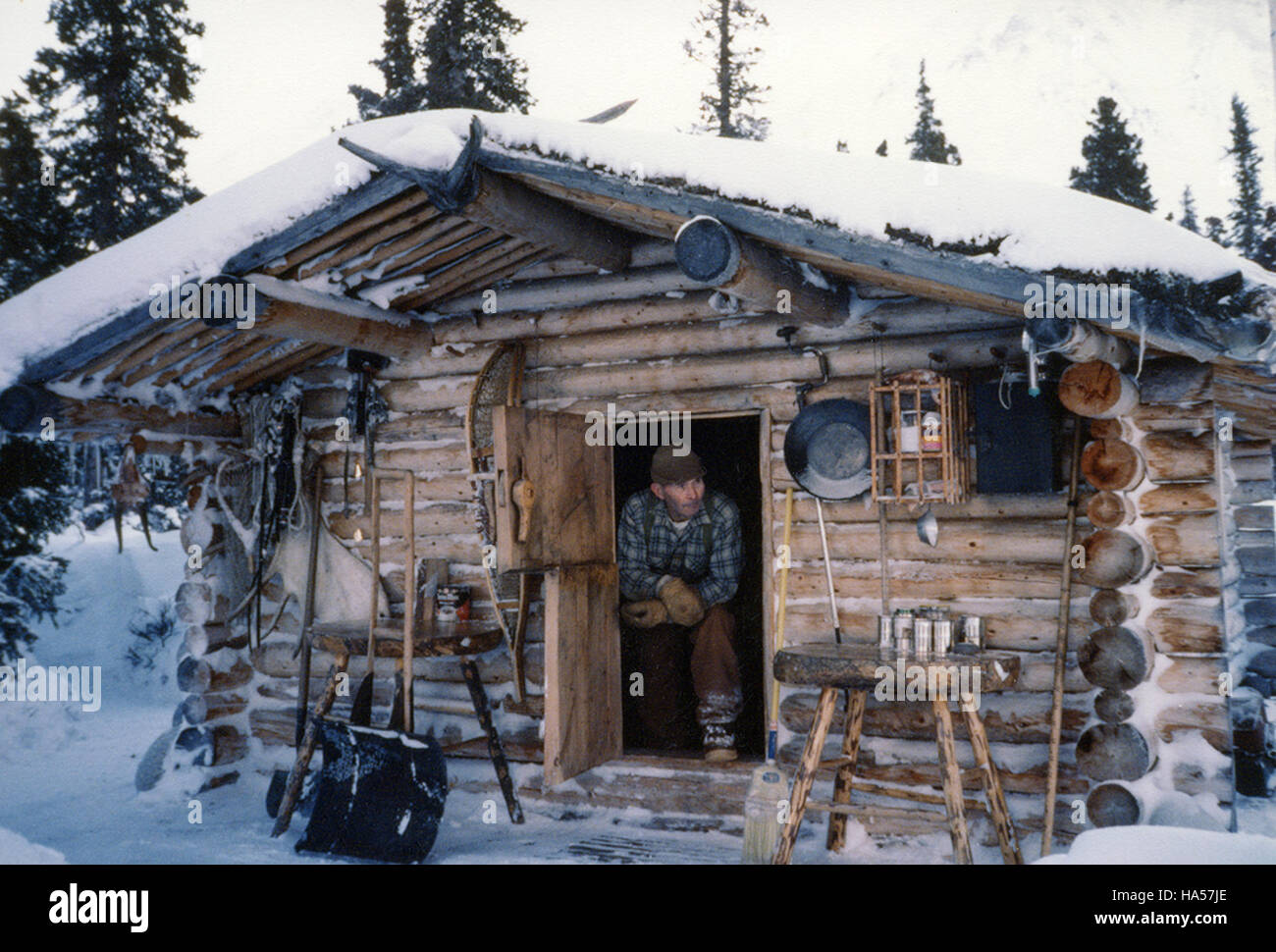 Dick Proenneke in the doorway of his cabin in May 1985, representing a ...
