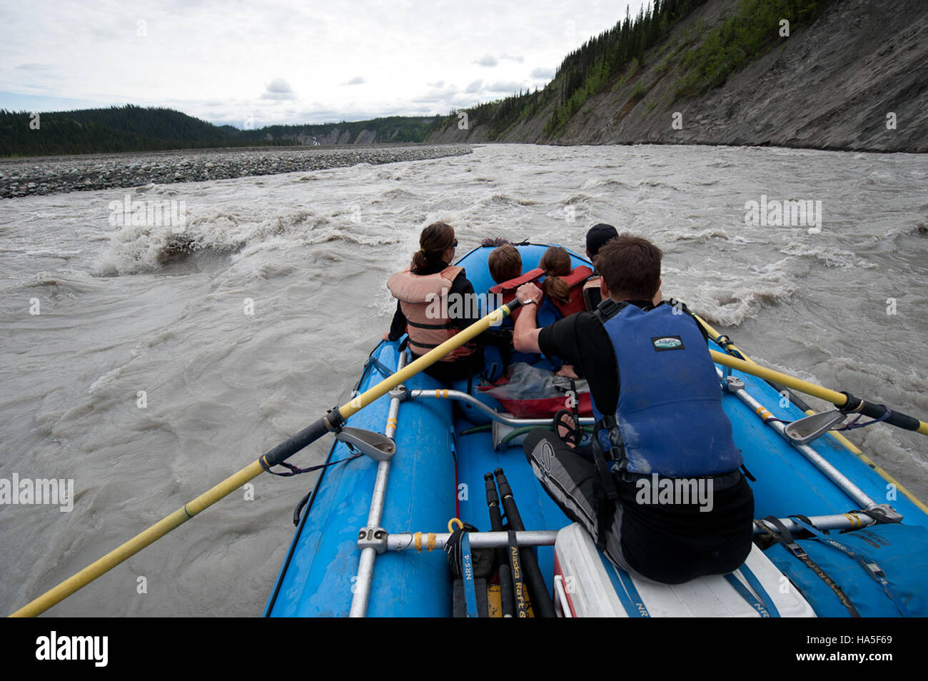 A group floats along a river in Wrangell-St. Elias National Park ...