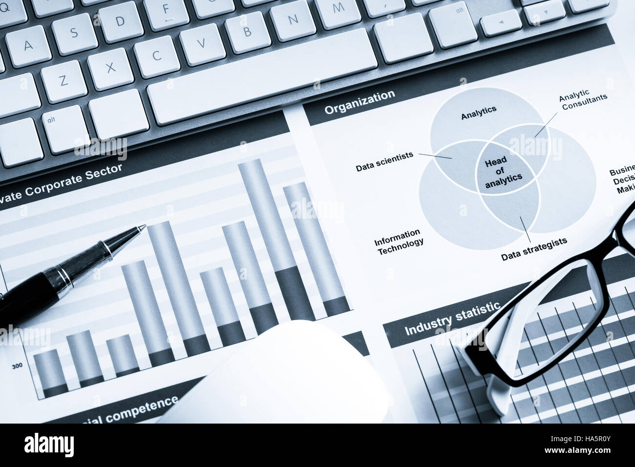 Business workplace with keyboard mouse and papers with graphs and ...