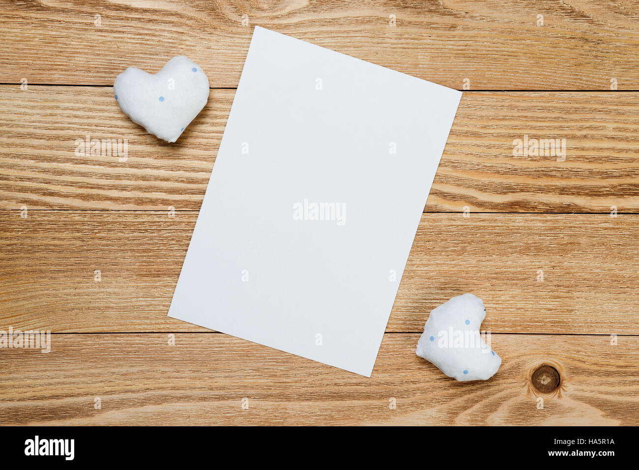 Blank paper sheet for writing on wooden table Stock Photo - Alamy