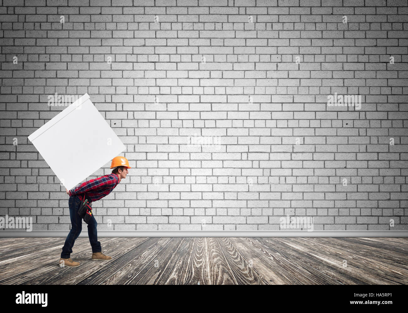 Man carrying on his back large box Stock Photo - Alamy