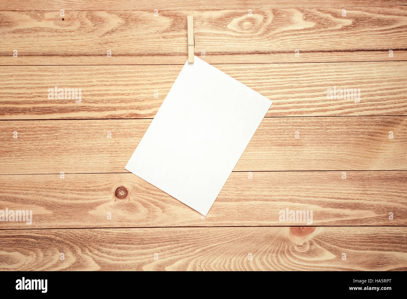 Blank paper sheets for text hanging on rope Stock Photo - Alamy