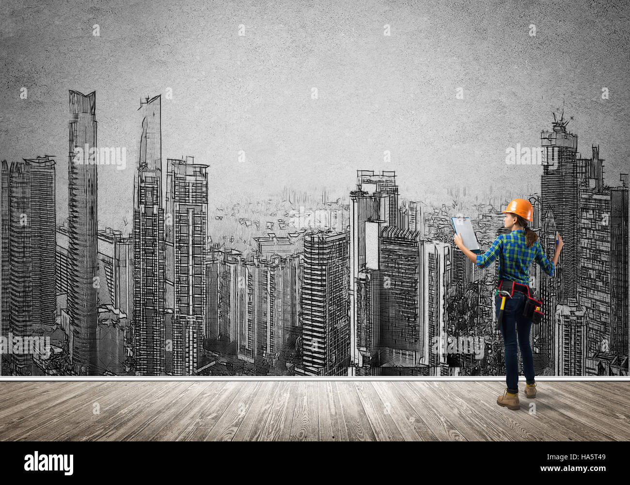 Back view of engineer woman with folder and sketches of construction ...