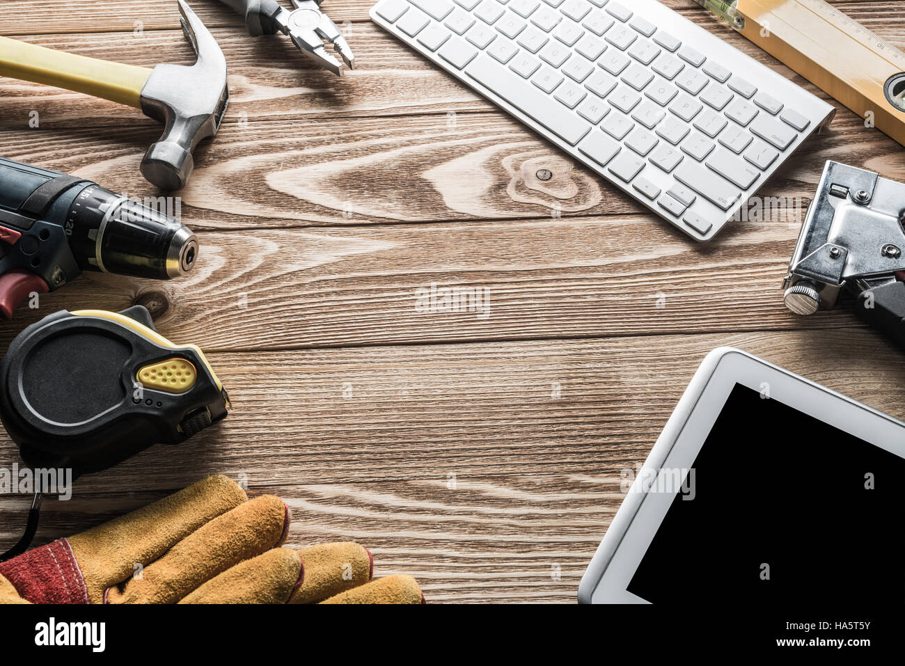 Variety of tools of builder and tablet pc on wooden texture table Stock ...