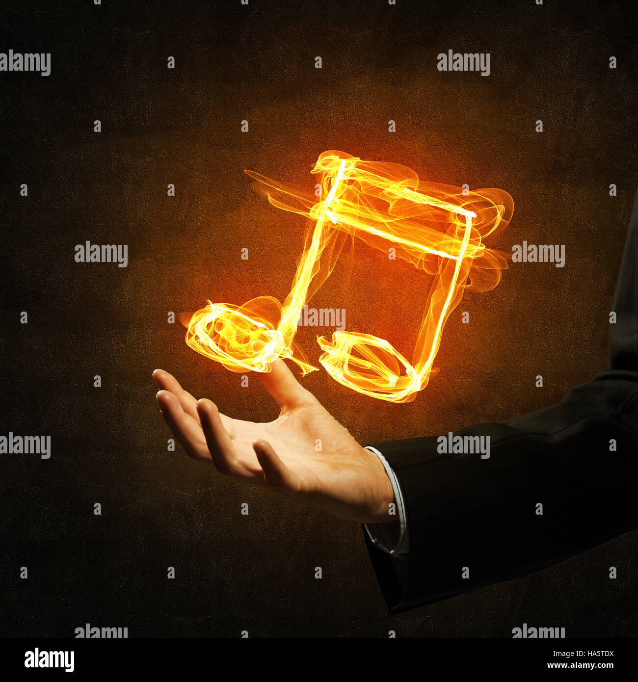Close up of person hand holding fire music symbol Stock Photo - Alamy