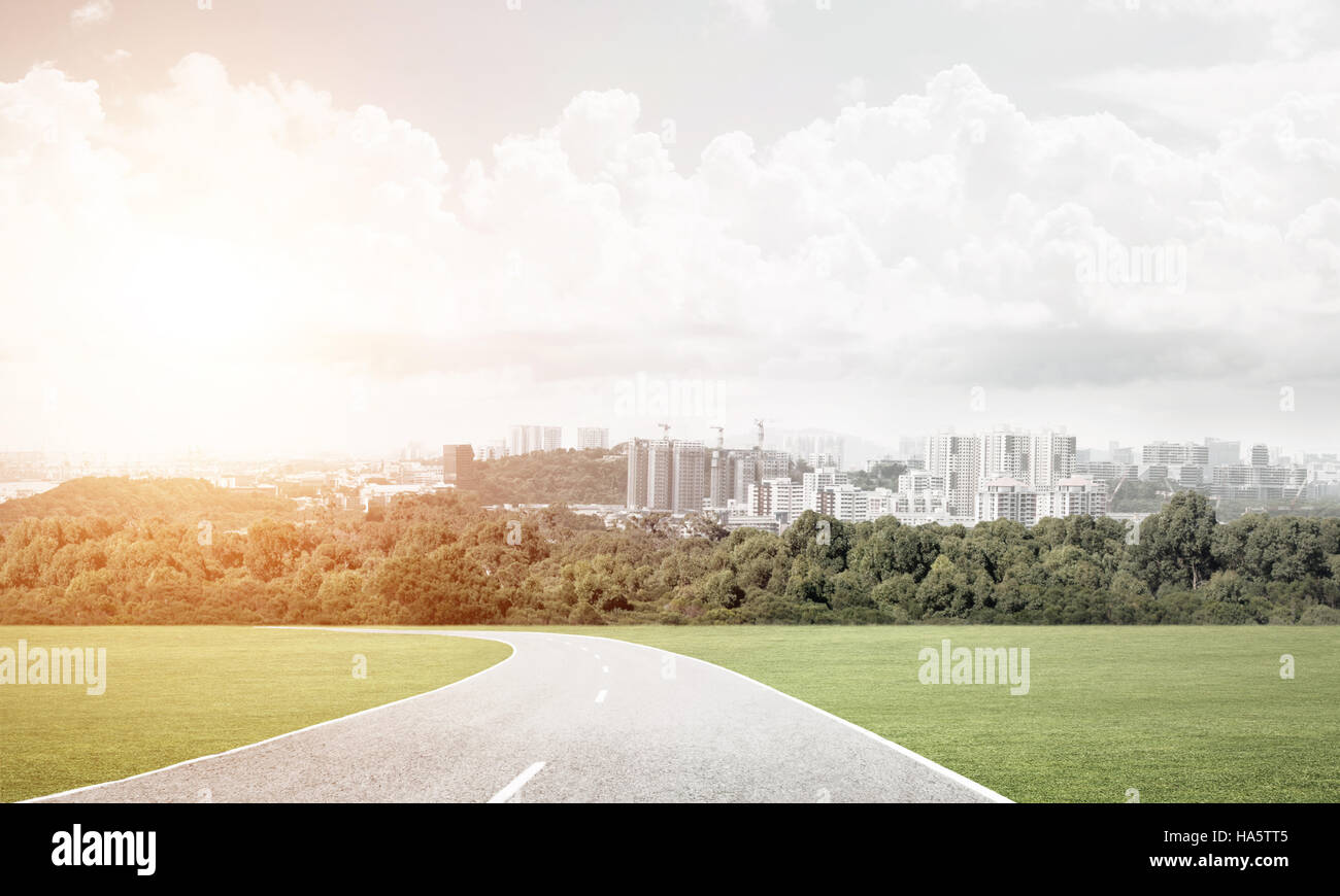 Natural landscape of countryside road and modern city Stock Photo - Alamy