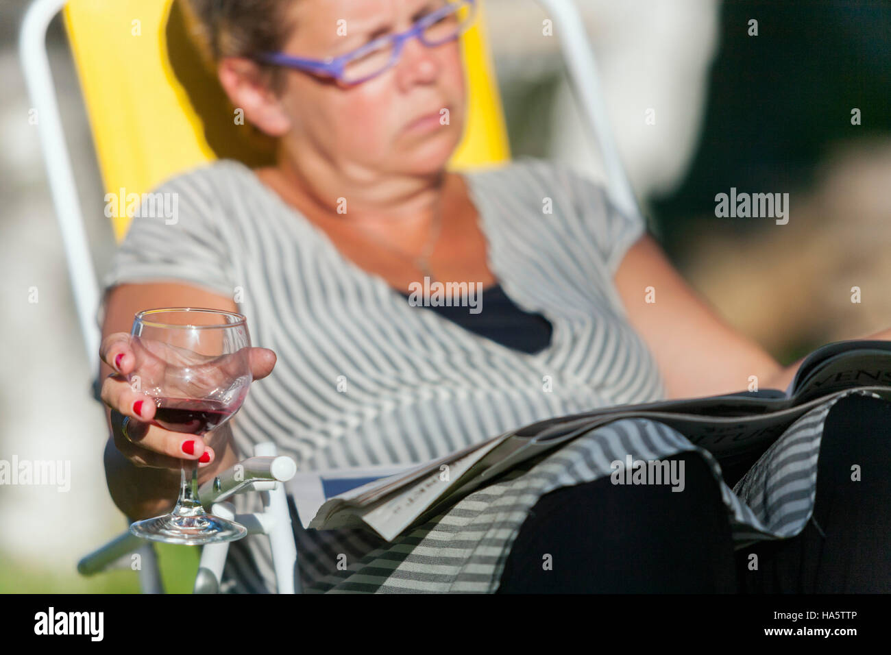Relaxing with a glass of wine Stock Photo - Alamy