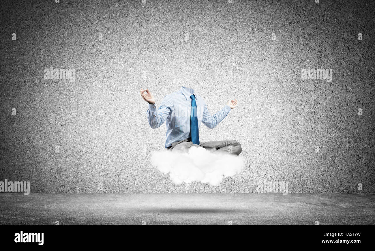 Headless businessman sitting on cloud in lotus pose and meditating ...