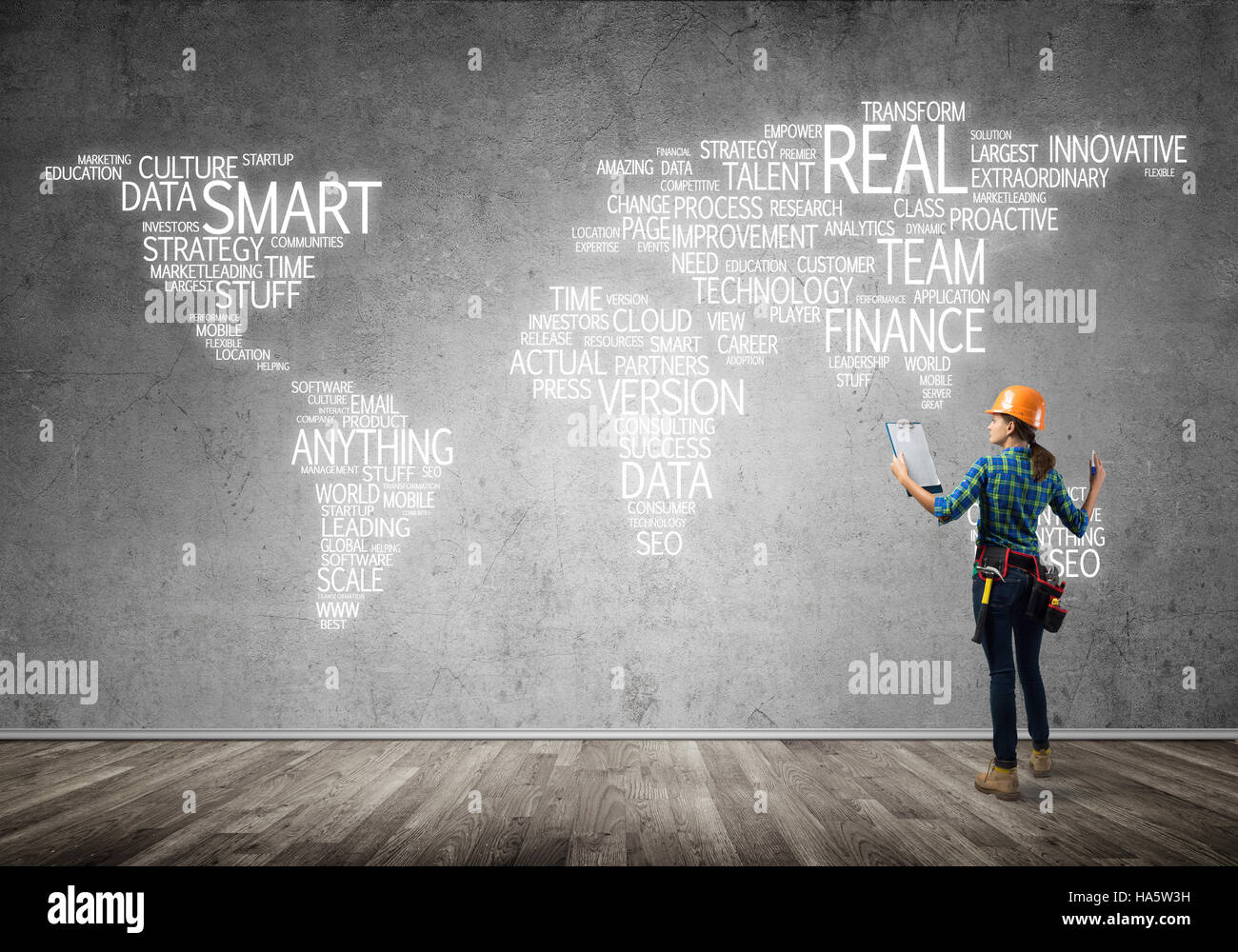 Female construction worker in room and globalization concept Stock ...