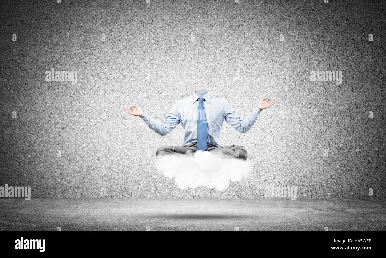 Headless businessman sitting on cloud in lotus pose and meditating ...