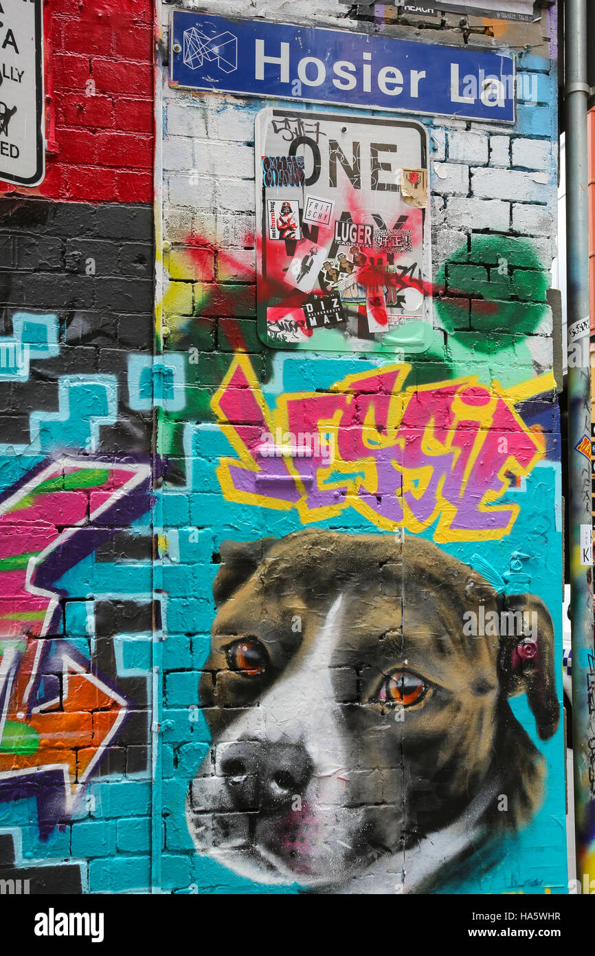 Colorful graffiti artwork in Hosier Lane with road name street sign ...
