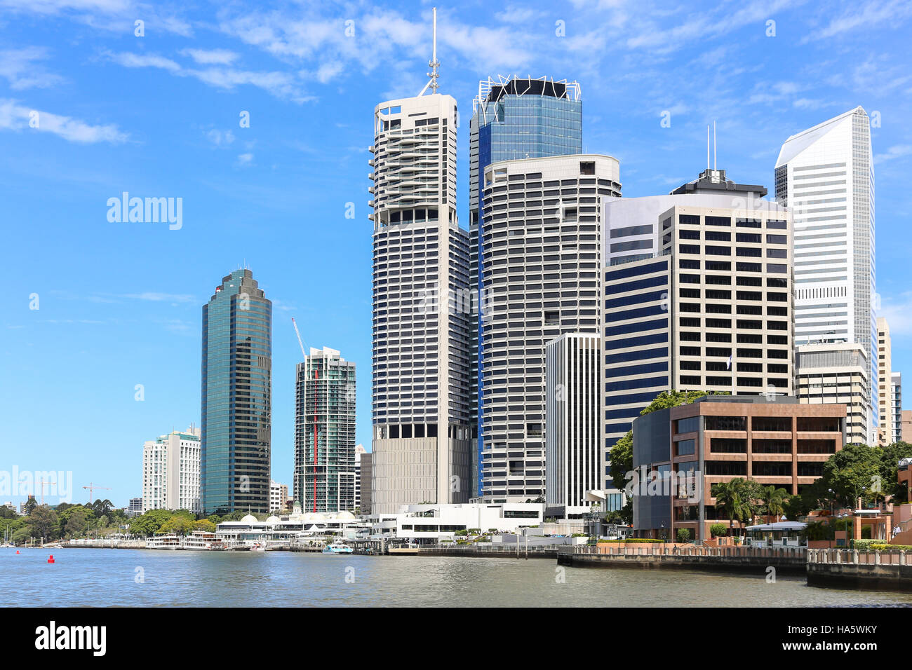 Brisbane city CBD skyline with skyscrapers next to the river promenade ...