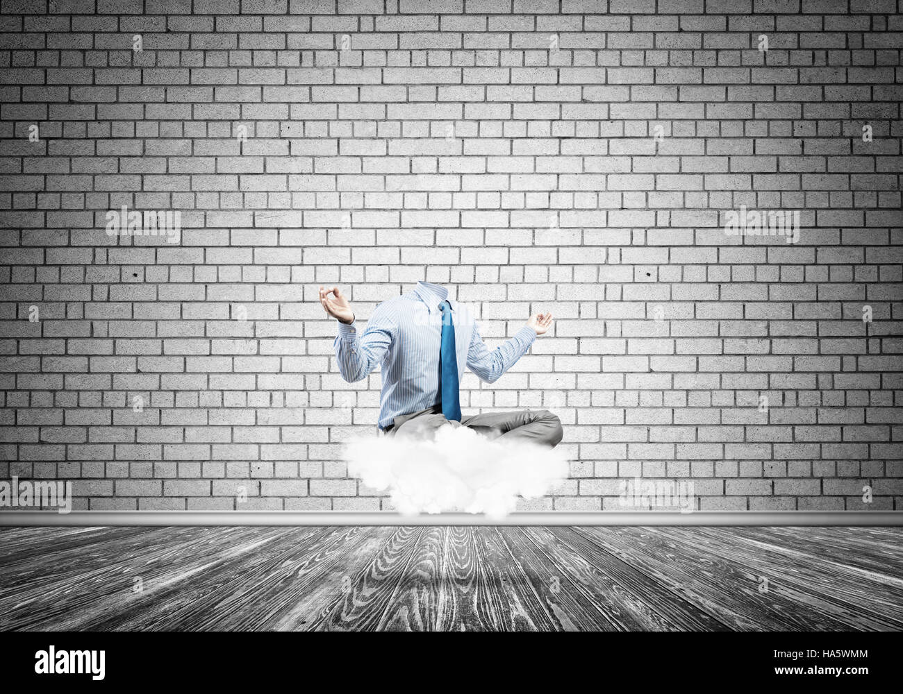 Headless businessman sitting on cloud in lotus pose and meditating ...
